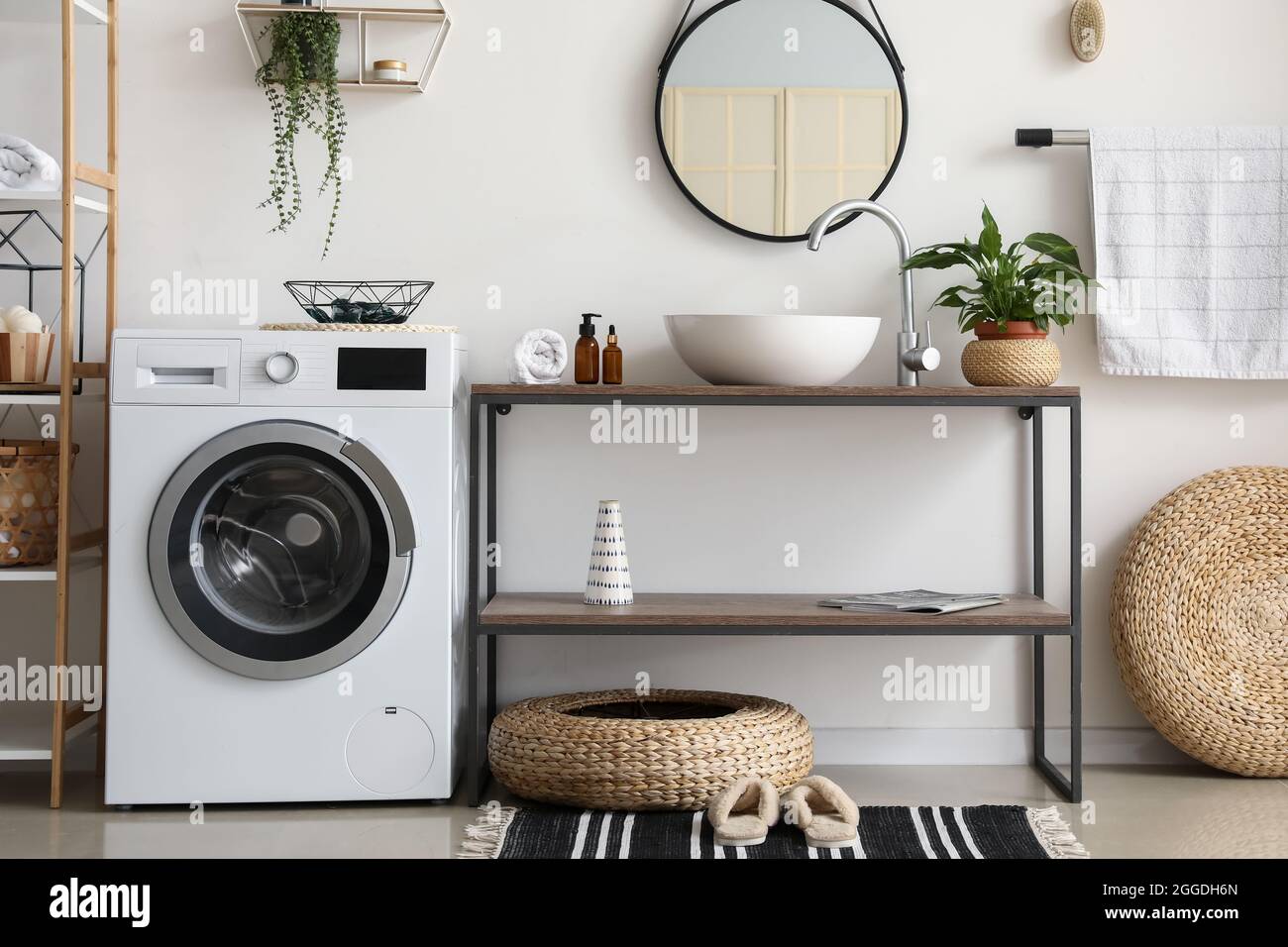Interior of bathroom with modern washing machine Stock Photo - Alamy