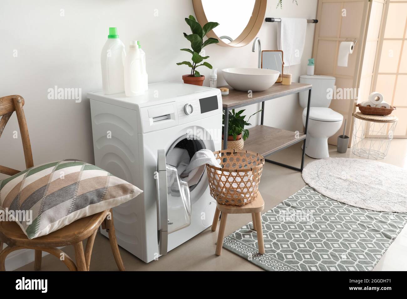 Interior of bathroom with modern washing machine Stock Photo - Alamy