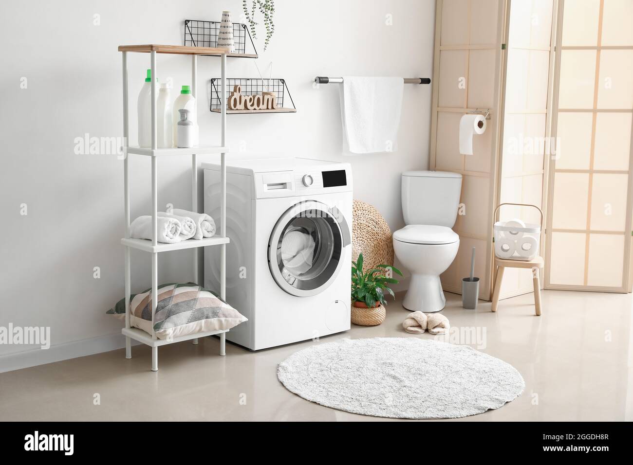 Interior of bathroom with modern washing machine Stock Photo - Alamy