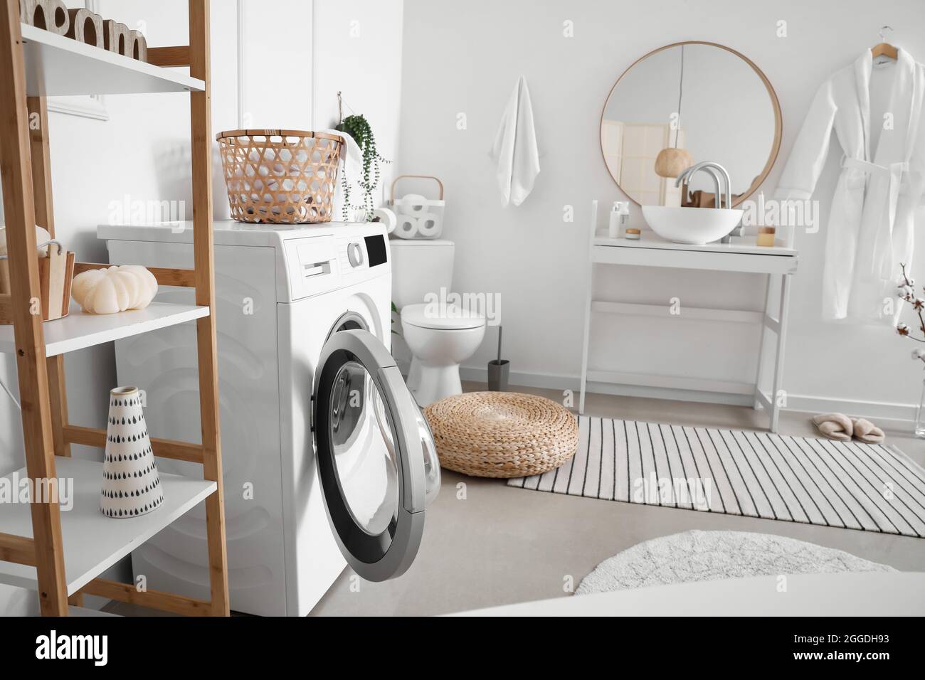 Interior of bathroom with modern washing machine Stock Photo - Alamy