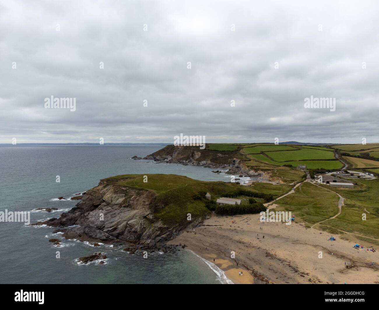 aerial drone around church cove and mullion golf course cornwall uk ...