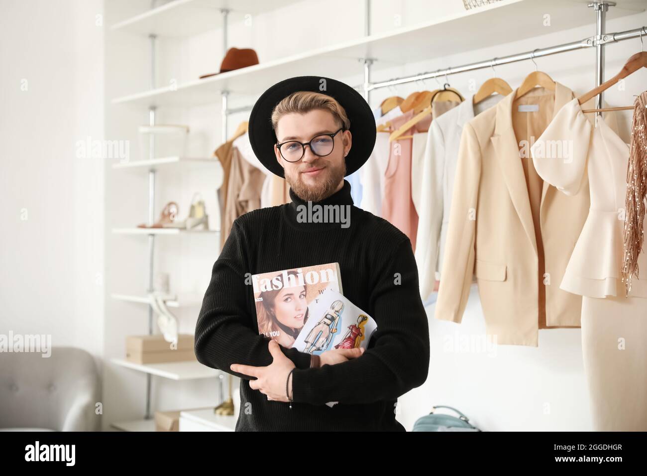 Male stylist working in studio Stock Photo - Alamy