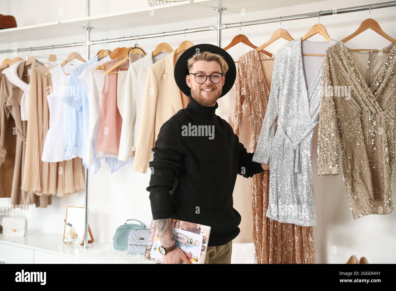 Male stylist working in studio Stock Photo - Alamy