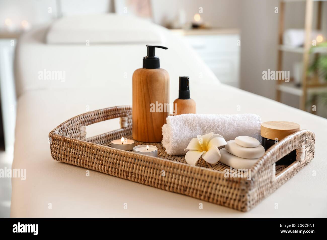 Tray with beautiful spa composition on couch in salon Stock Photo - Alamy