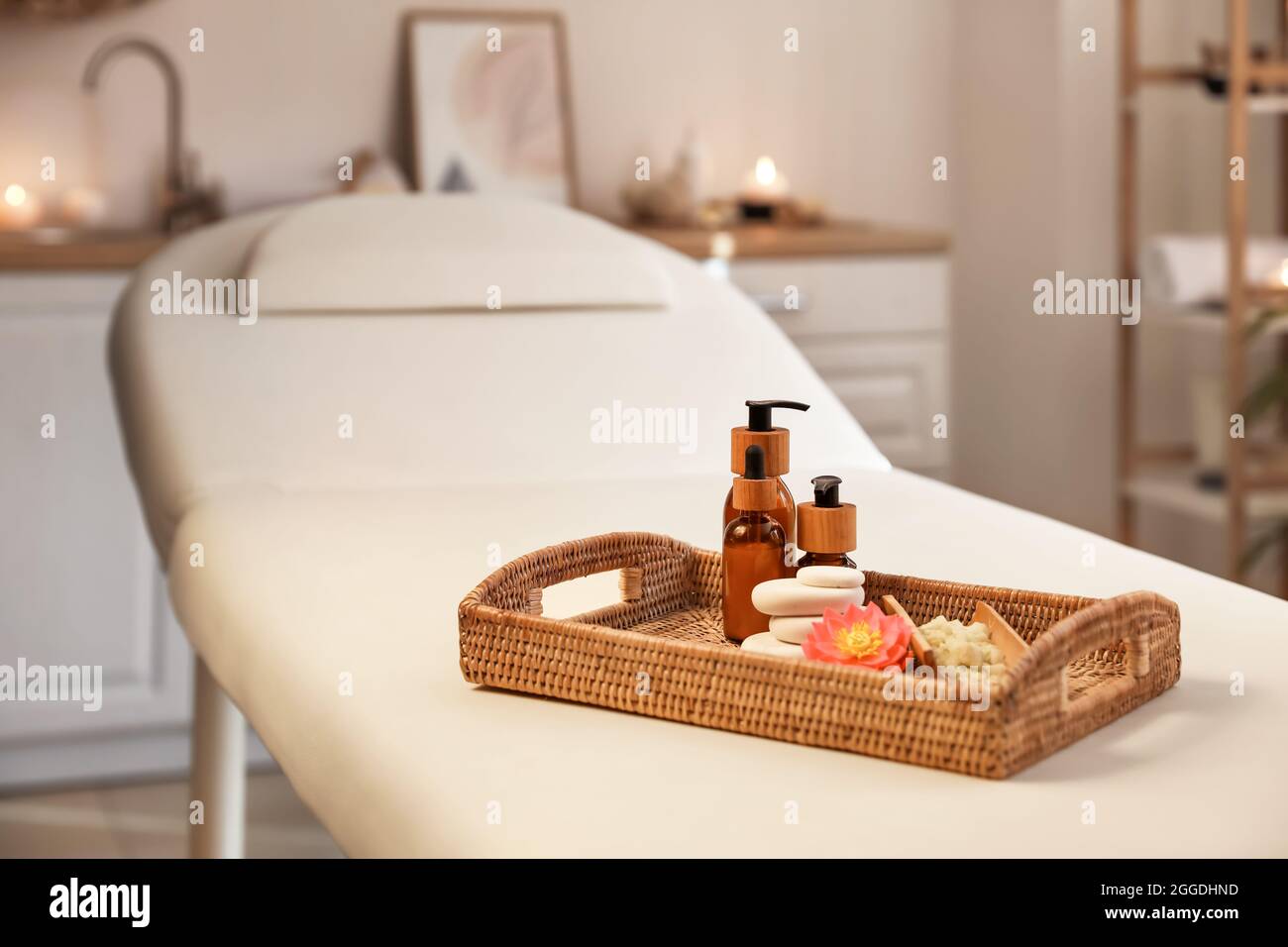 Tray with beautiful spa composition on couch in salon Stock Photo - Alamy