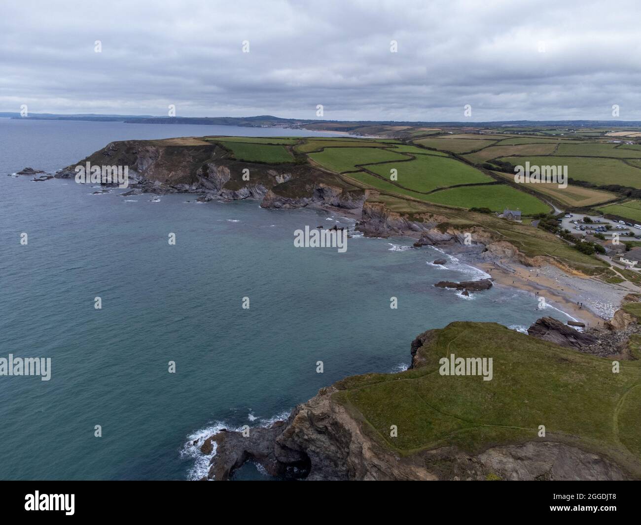 aerial drone around church cove and mullion golf course cornwall uk ...