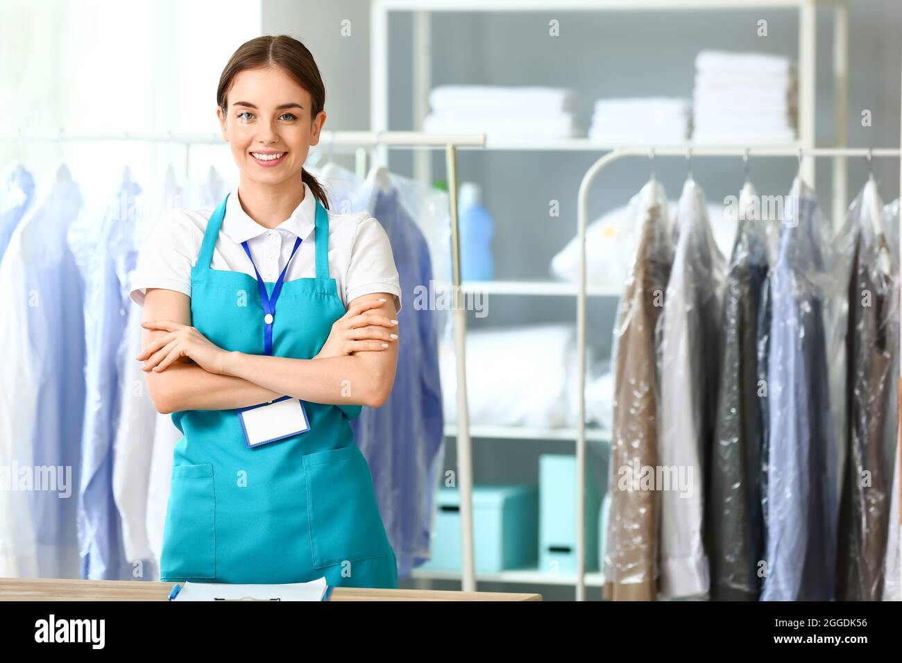 Female worker at modern dry-cleaner's Stock Photo - Alamy