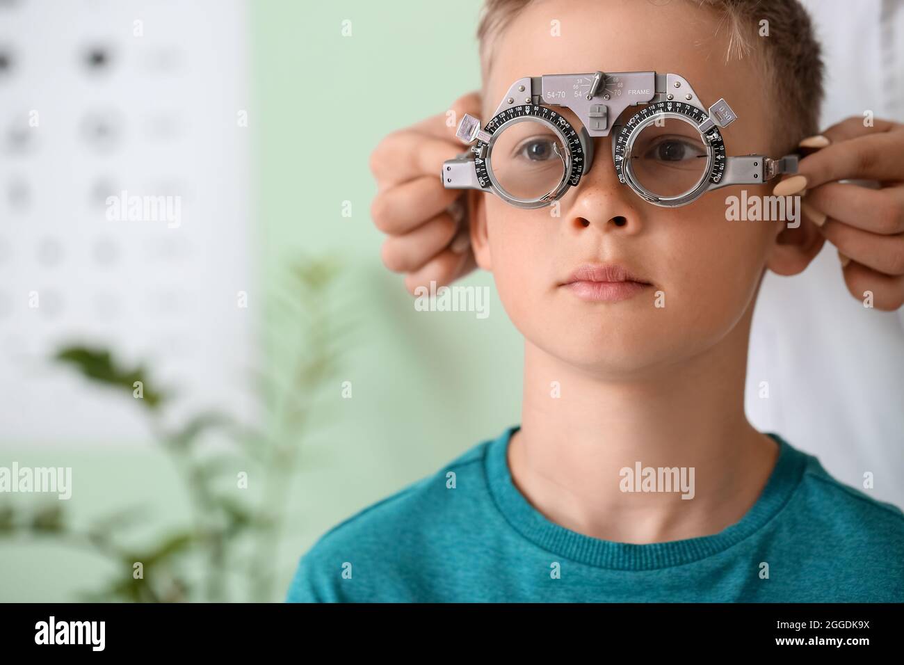 Little boy undergoing eye test in clinic Stock Photo - Alamy