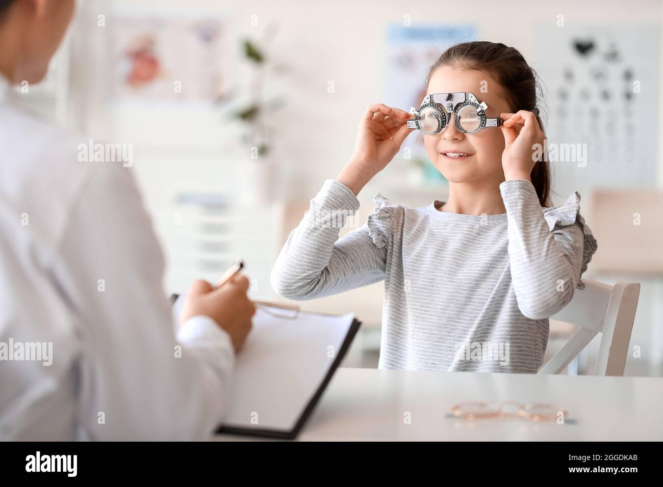 Little girl undergoing eye test in clinic Stock Photo - Alamy