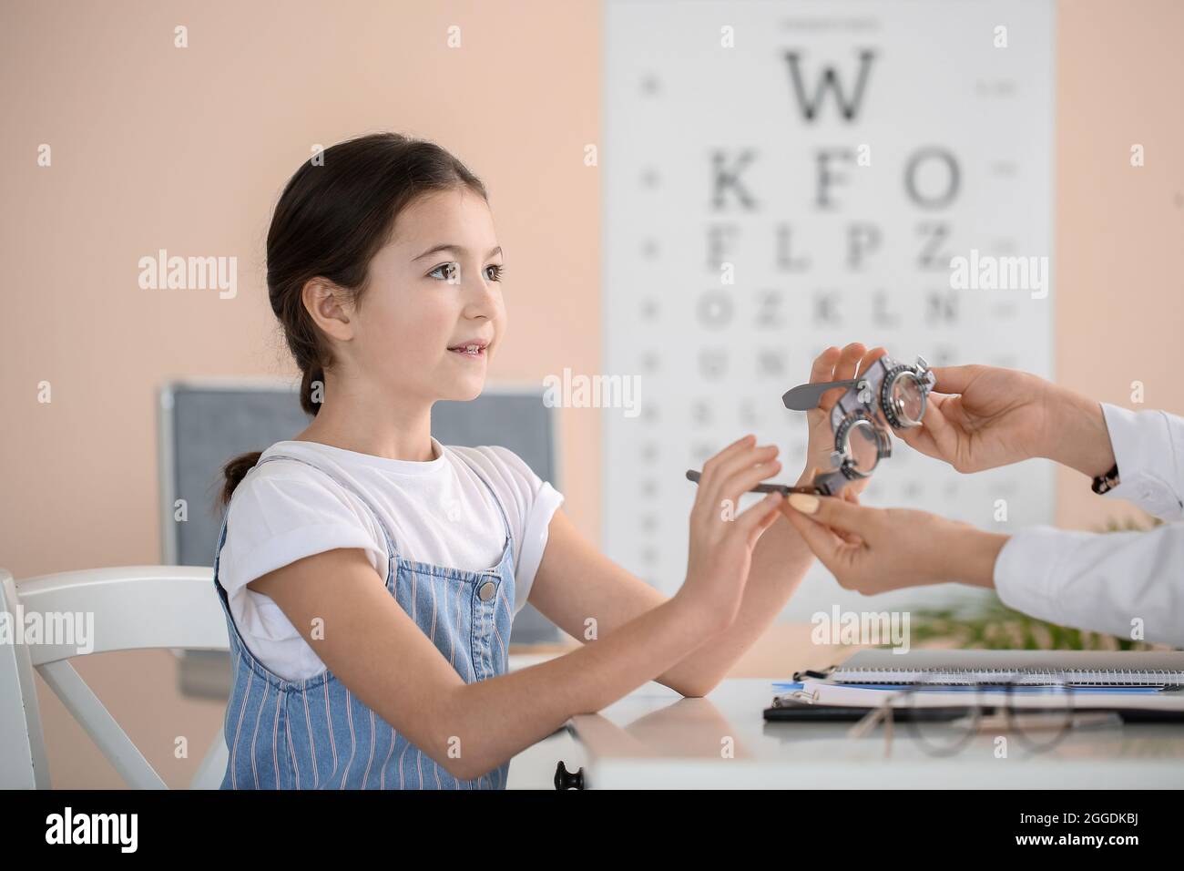 Little girl undergoing eye test in clinic Stock Photo - Alamy