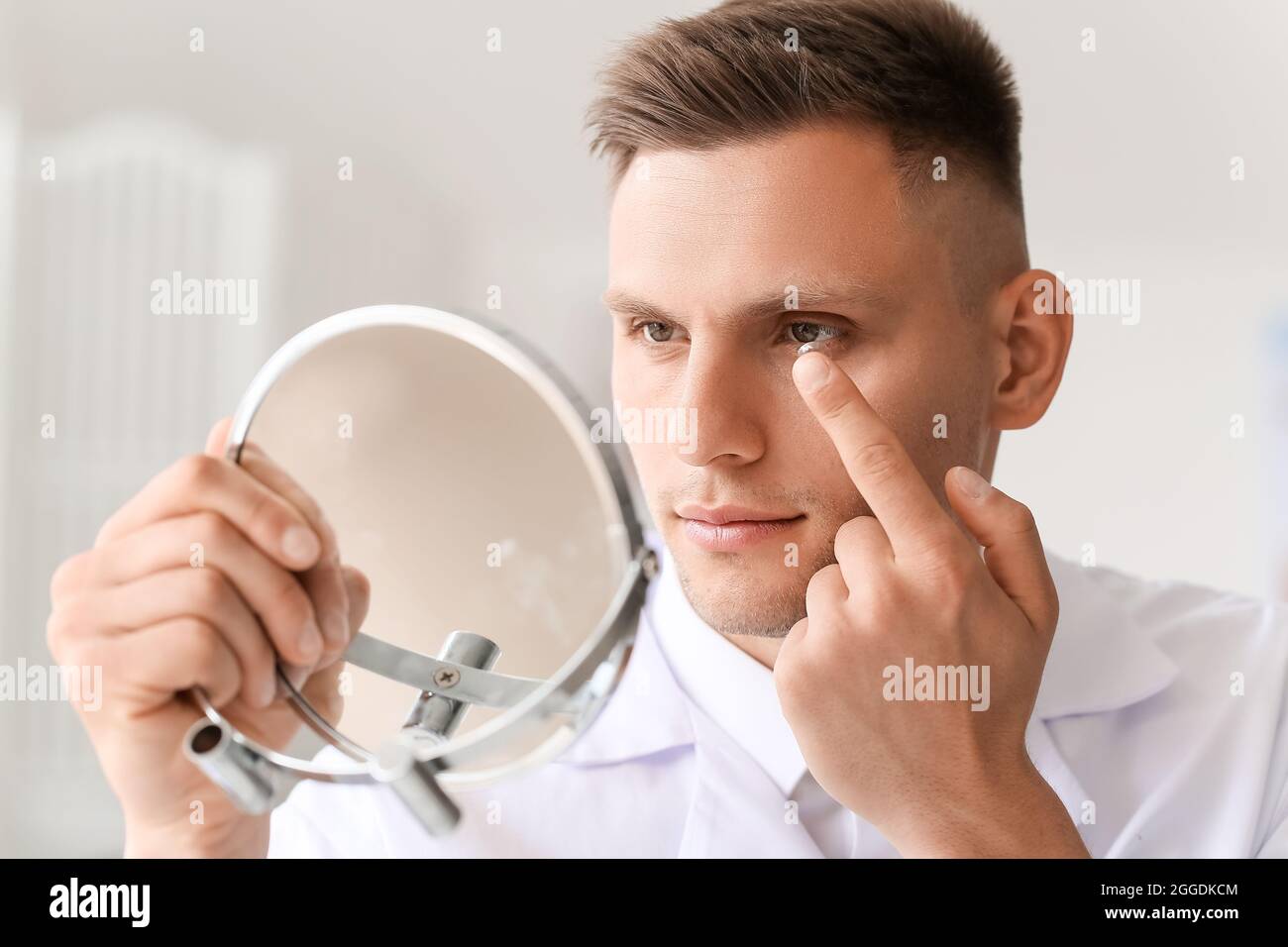 Check eye in mirror hi-res stock photography and images - Alamy