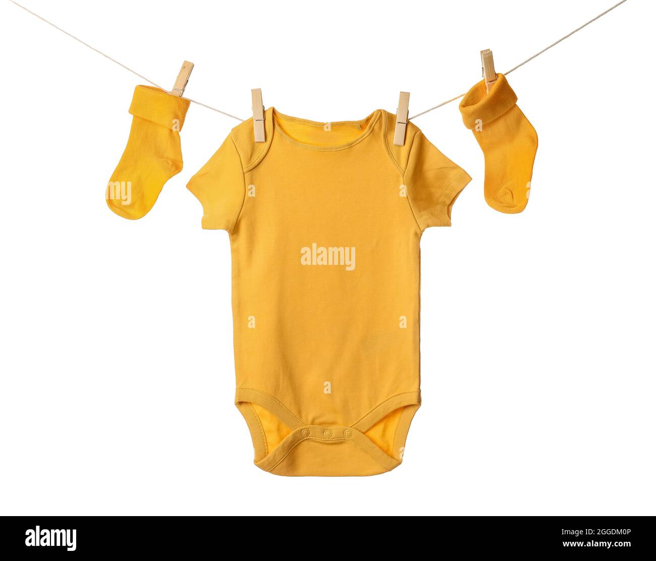 Baby clothes hanging on rope against white background Stock Photo - Alamy