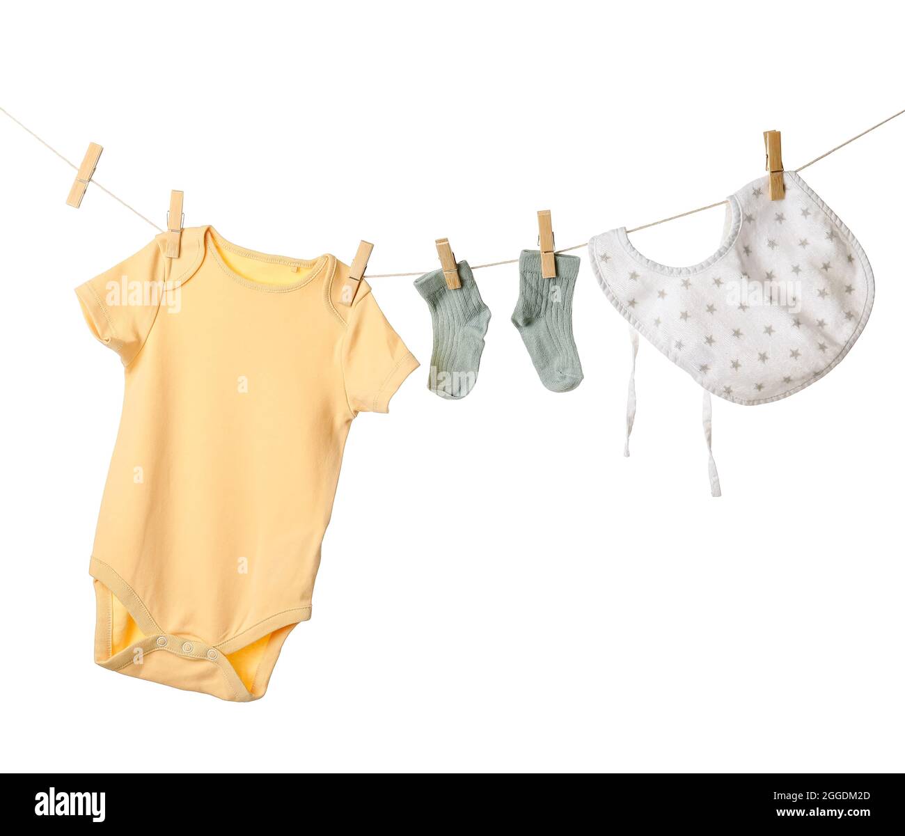 Baby clothes and bib hanging on rope against white background Stock ...