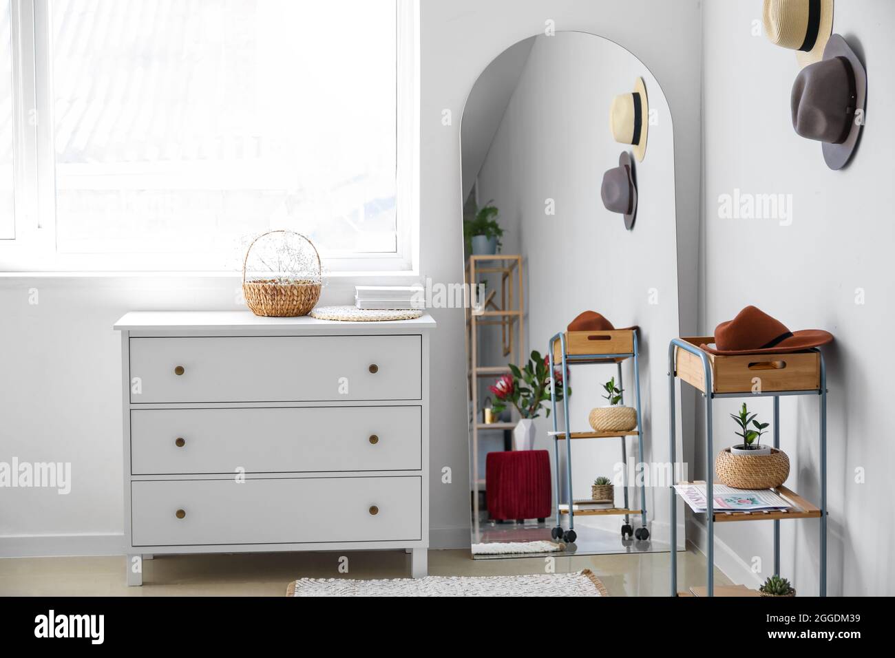 Stylish interior of modern room with mirror Stock Photo - Alamy