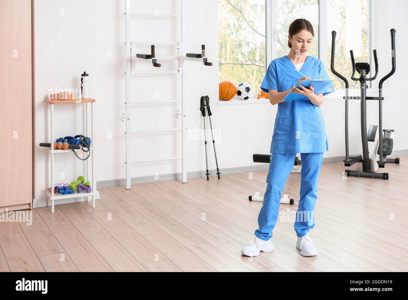 Female physiotherapist in rehabilitation center Stock Photo - Alamy