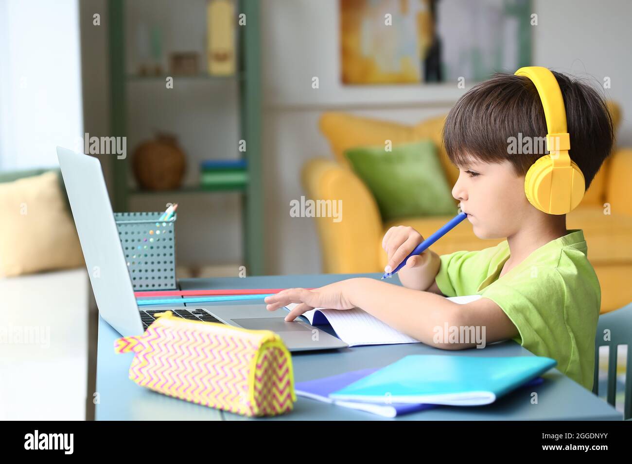 Little boy studying online at home Stock Photo - Alamy