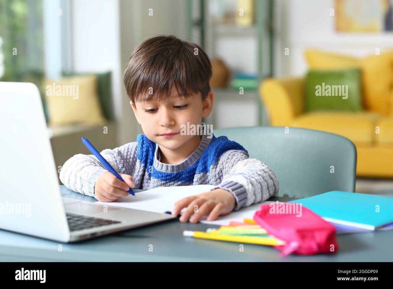 Little boy studying online at home Stock Photo - Alamy
