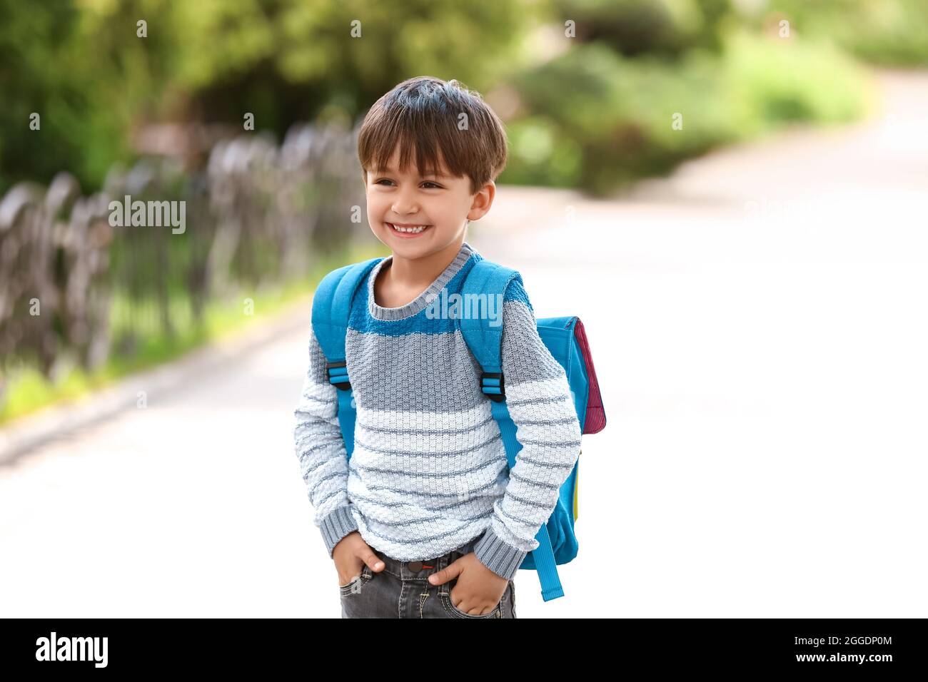 Little schoolboy with backpack outdoors Stock Photo - Alamy