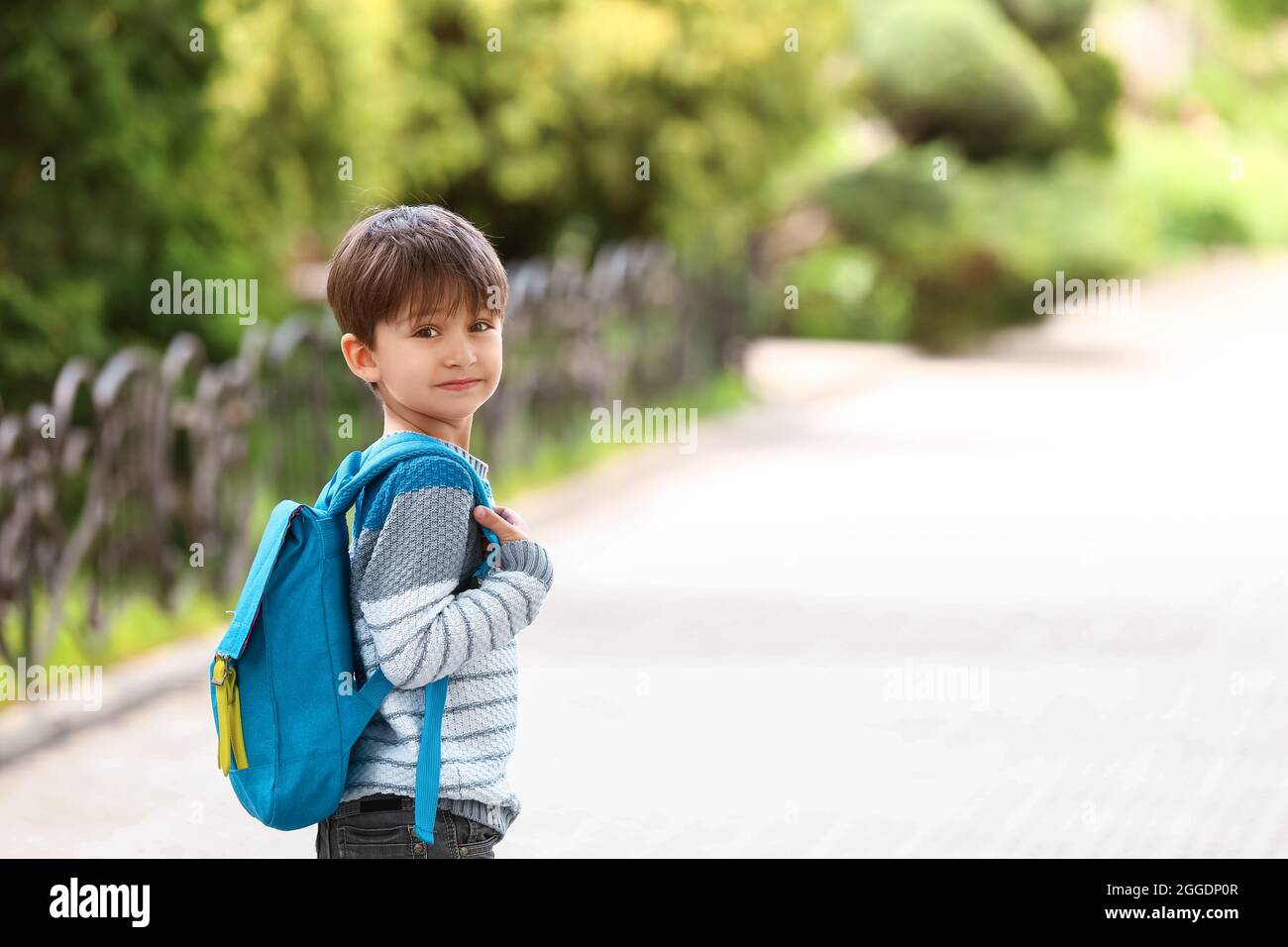 Little schoolboy with backpack outdoors Stock Photo - Alamy