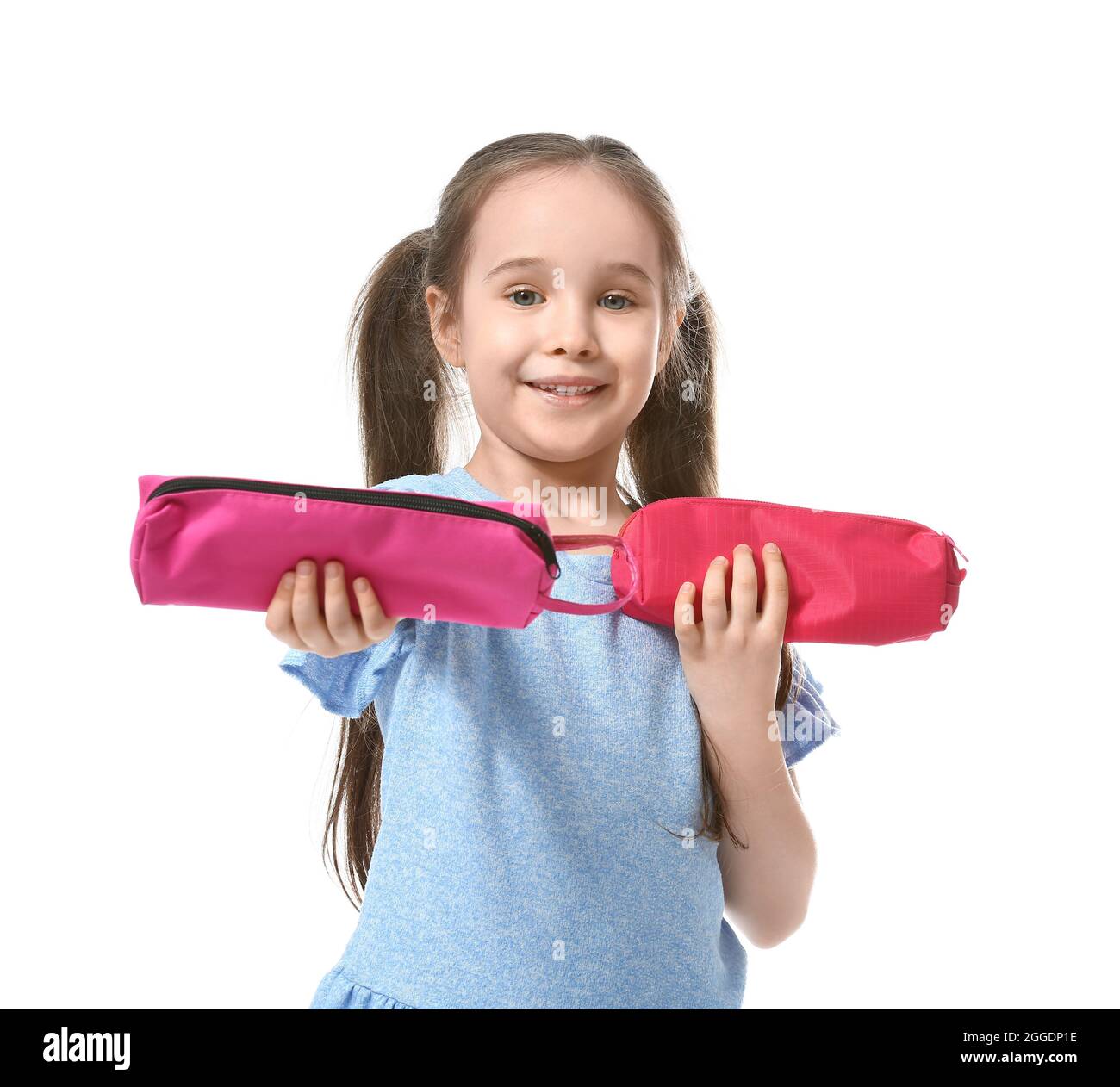 Little girl with pencil cases on white background Stock Photo - Alamy