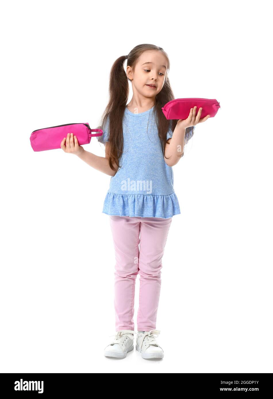 Little girl with pencil cases on white background Stock Photo - Alamy