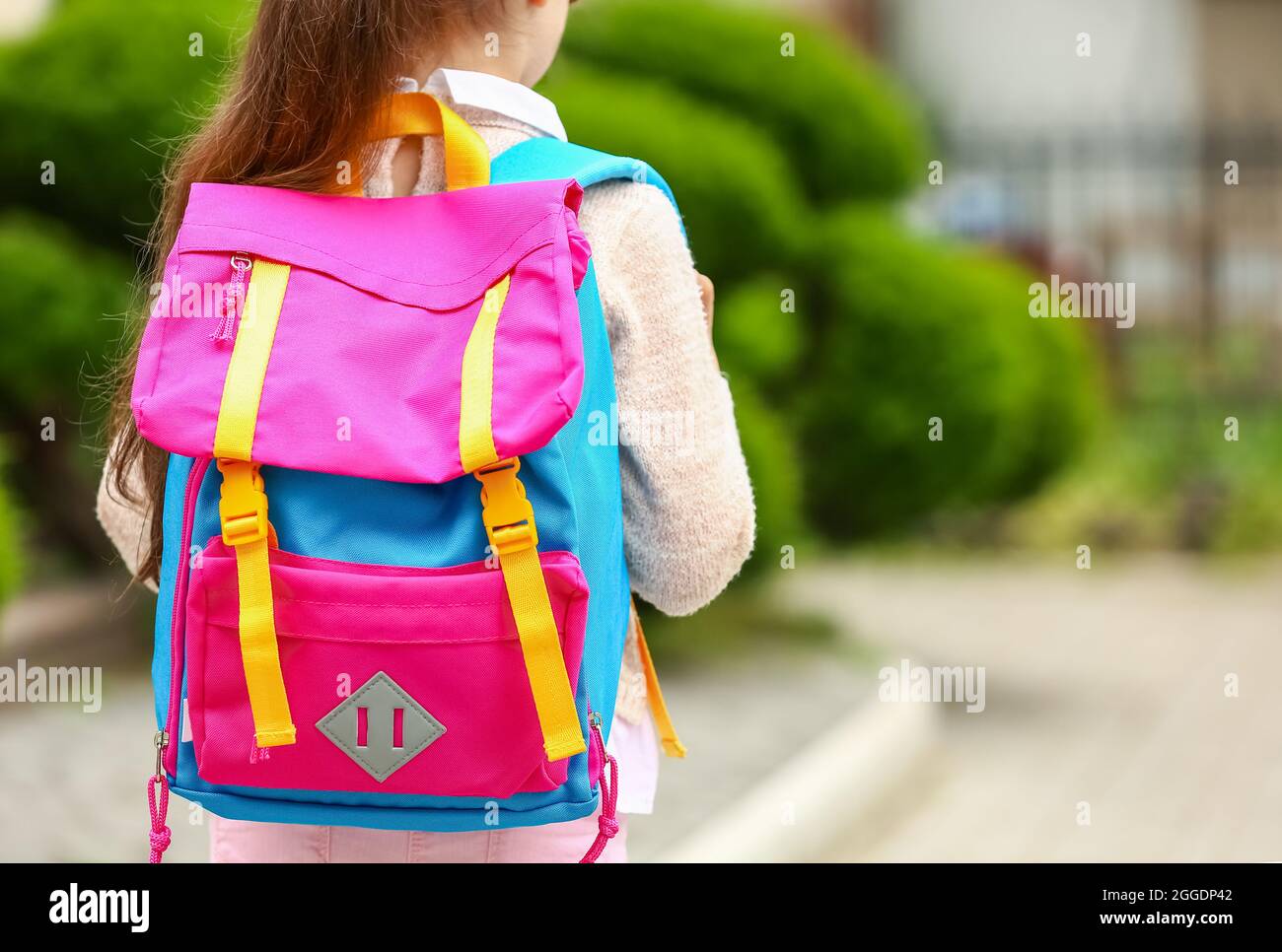 Little schoolgirl with backpack outdoors Stock Photo - Alamy