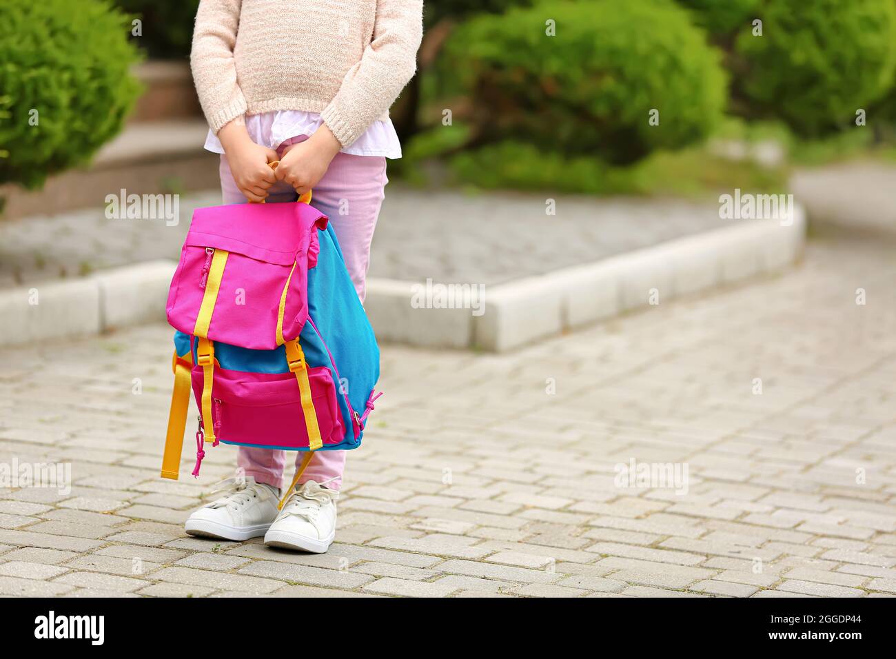 Little schoolgirl with backpack outdoors Stock Photo - Alamy