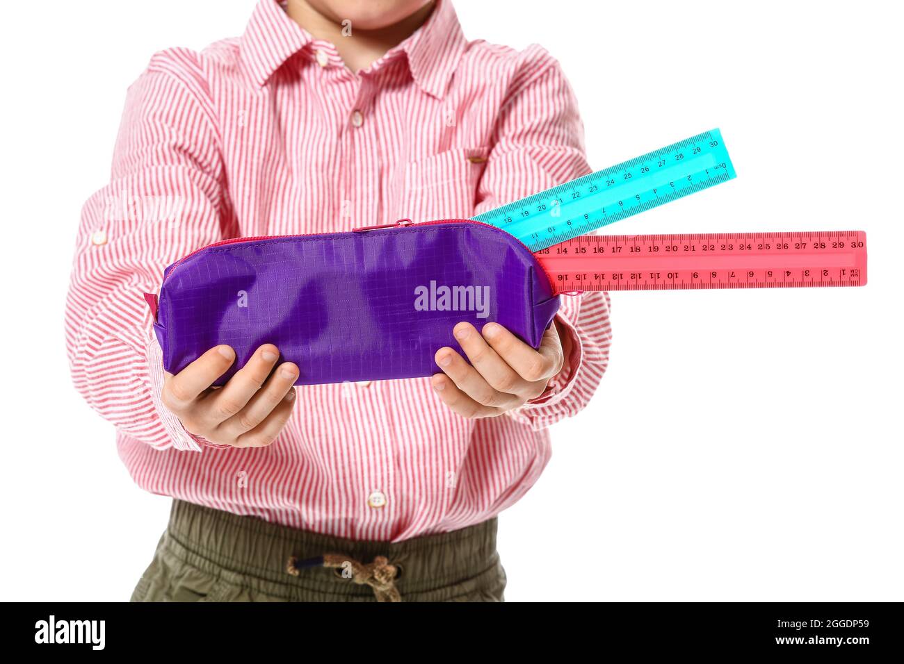 Little boy with pencil case and rulers on white background Stock Photo ...