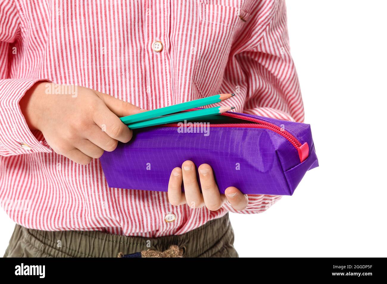 Little boy putting pencils in case on white background Stock Photo - Alamy