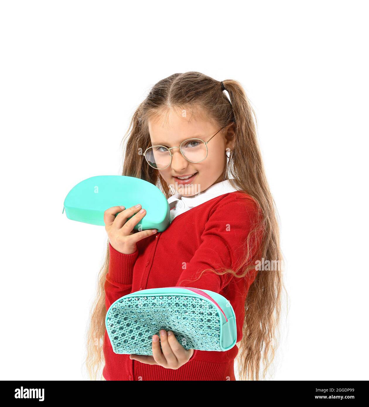 Little girl with pencil cases on white background Stock Photo - Alamy