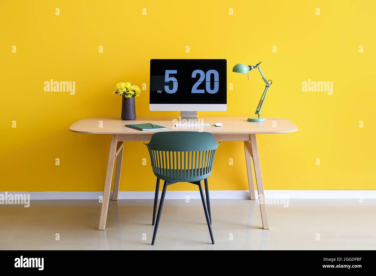 Modern workplace with computer near color wall Stock Photo - Alamy