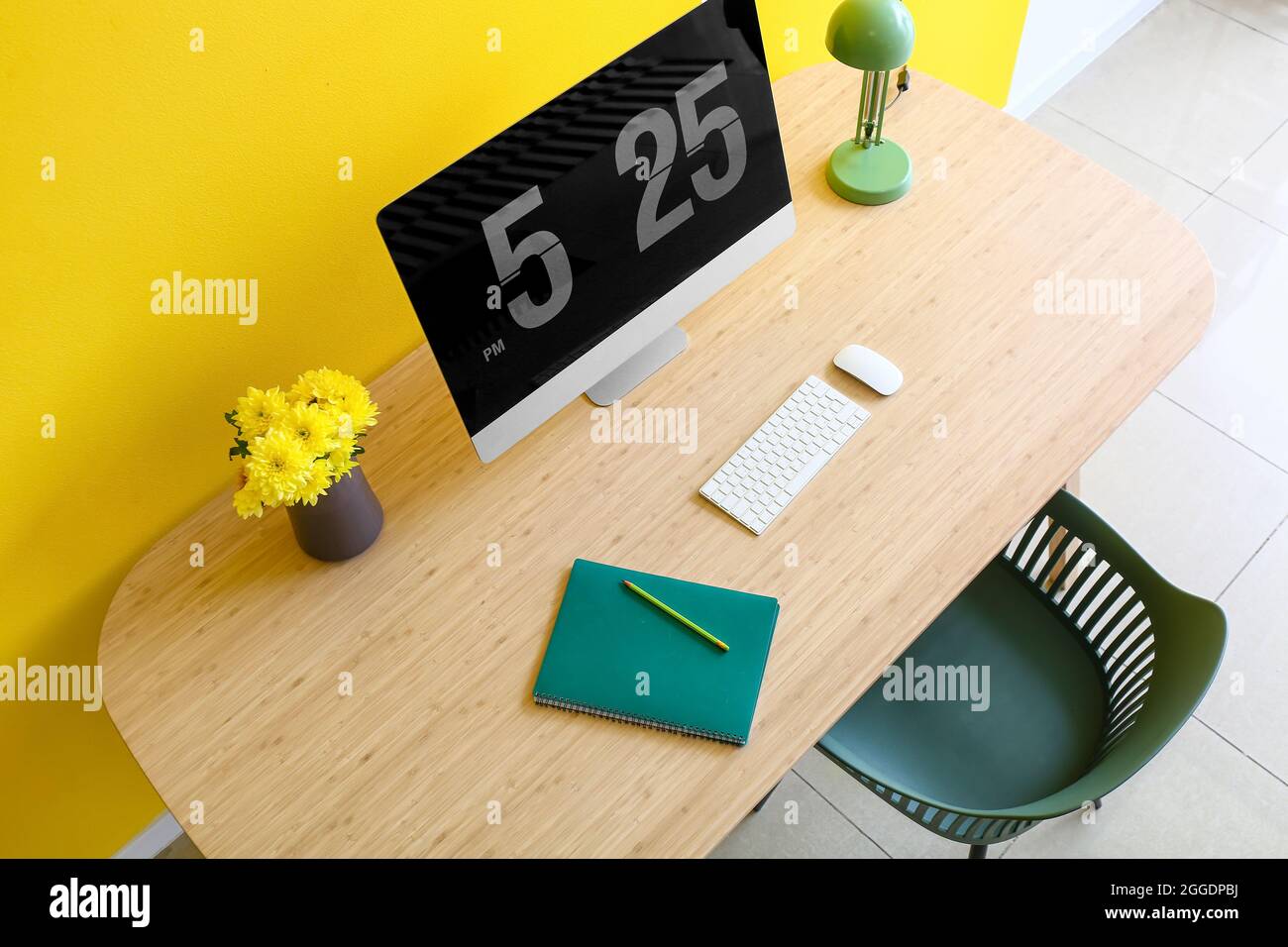 Modern workplace with computer near color wall Stock Photo - Alamy