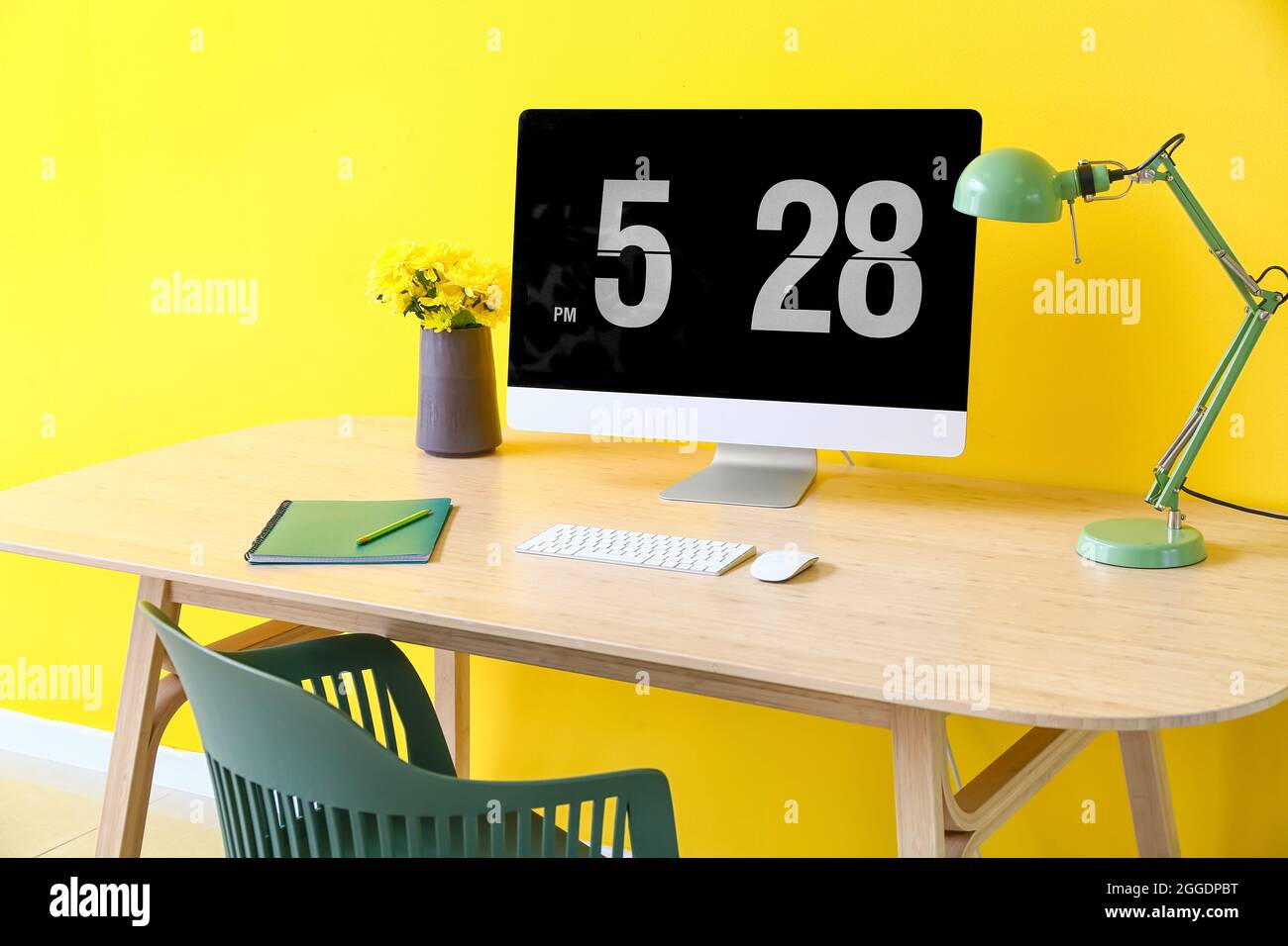 Modern workplace with computer near color wall Stock Photo - Alamy