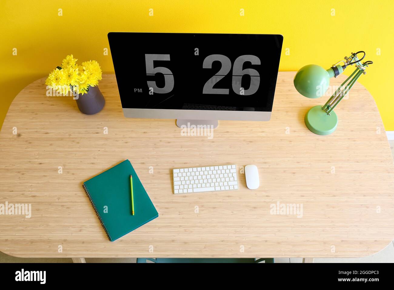 Modern workplace with computer near color wall Stock Photo - Alamy