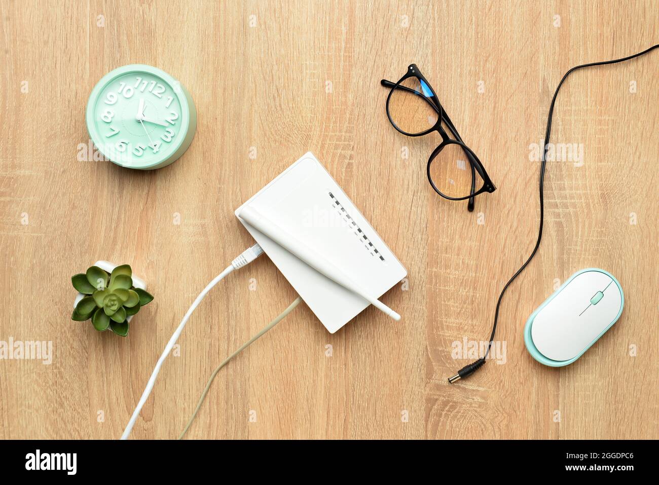 Composition with modern wi-fi router on table Stock Photo - Alamy