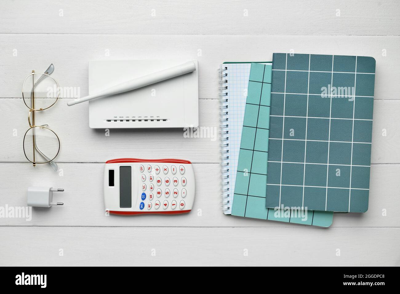 Composition with modern wi-fi router, stationery and calculator on ...