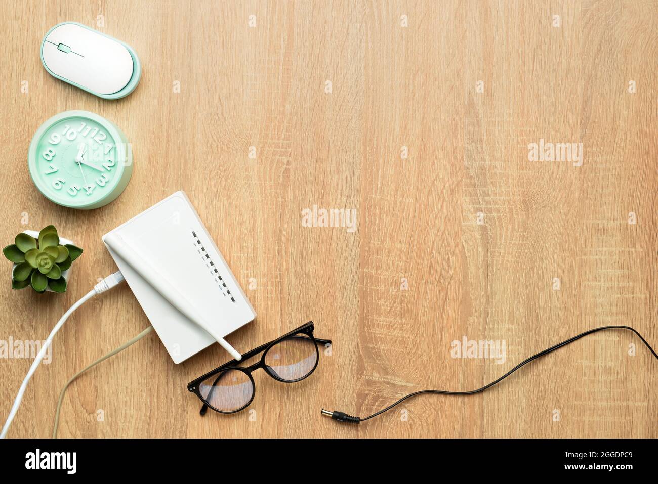 Composition with modern wi-fi router on table Stock Photo - Alamy