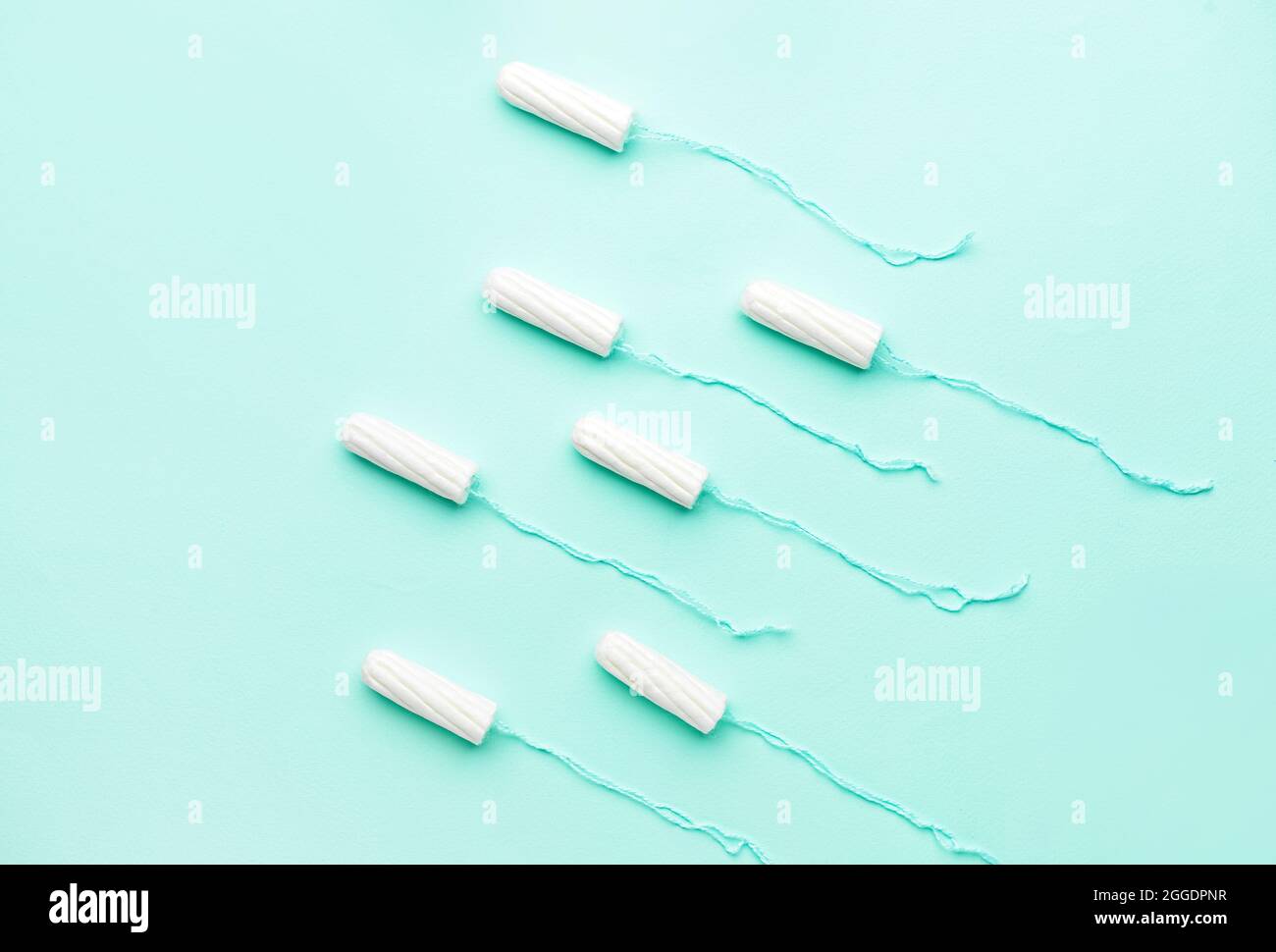 Tampons on color background, top view Stock Photo - Alamy