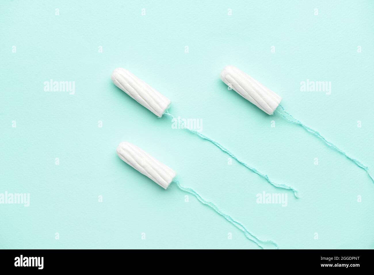 Tampons on color background, top view Stock Photo - Alamy
