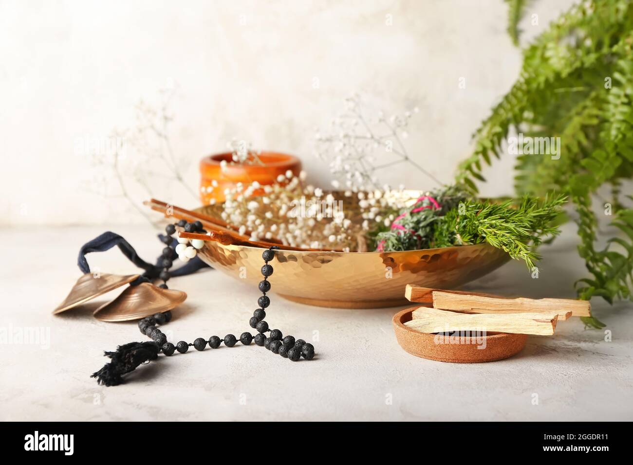 Palo Santo, beads, karatalas and incense on light background Stock ...