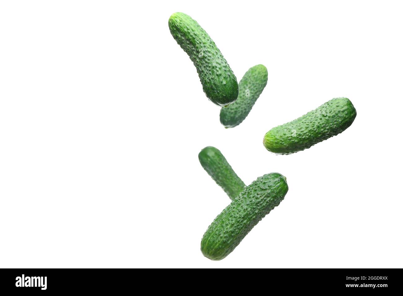 Flying cucumbers on white background Stock Photo - Alamy