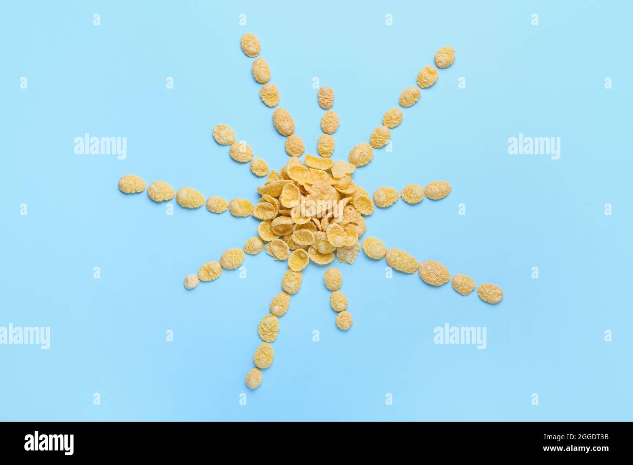 Sun made of cornflakes on color background Stock Photo - Alamy