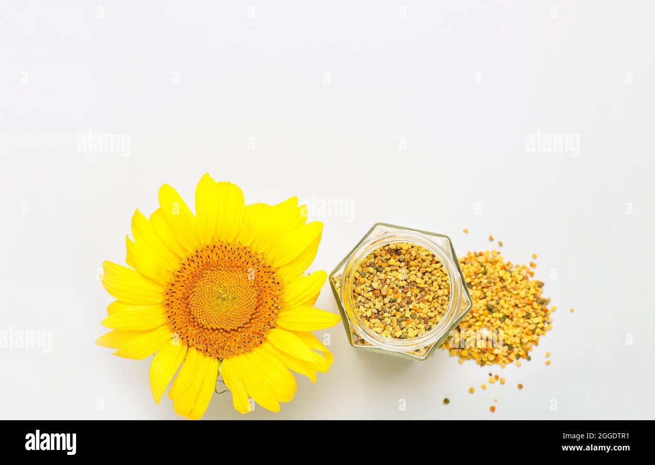 Jar of bee pollen on light background Stock Photo - Alamy