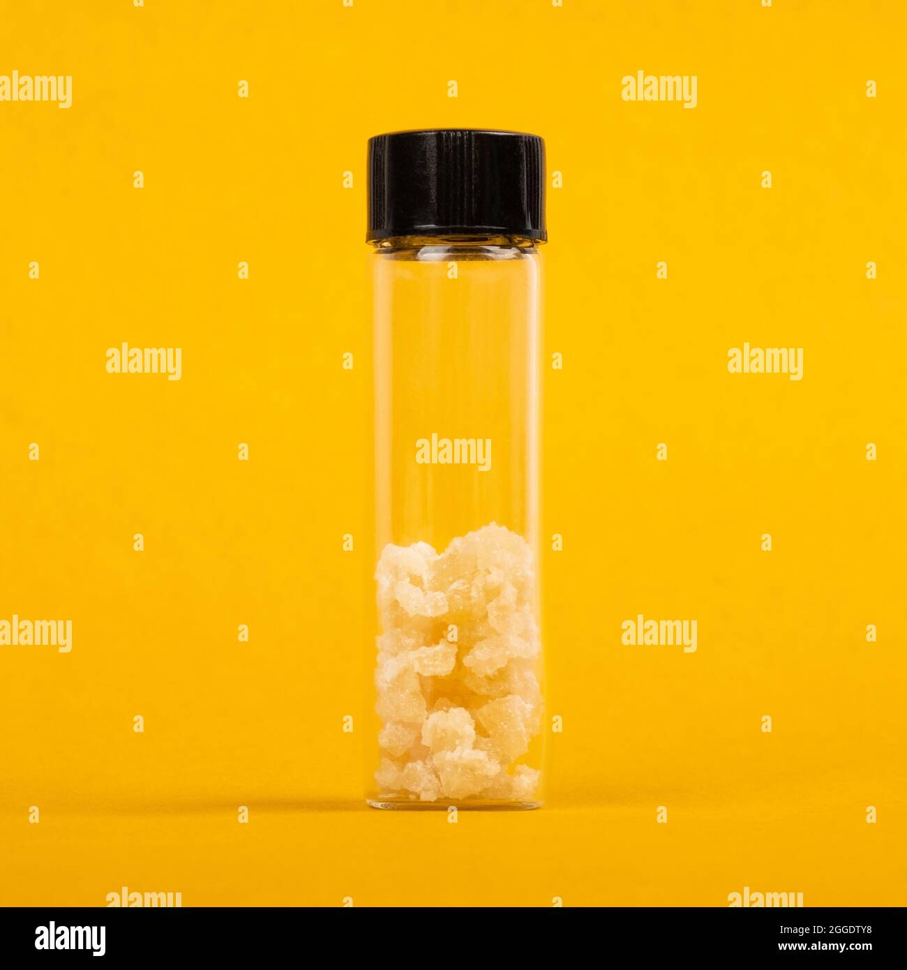 a pieces of pure hash dab crystal cannabis on yellow background Stock ...