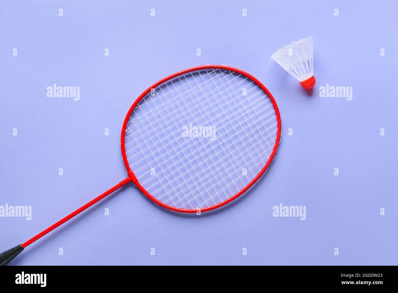 Badminton racket and shuttlecock on color background Stock Photo - Alamy