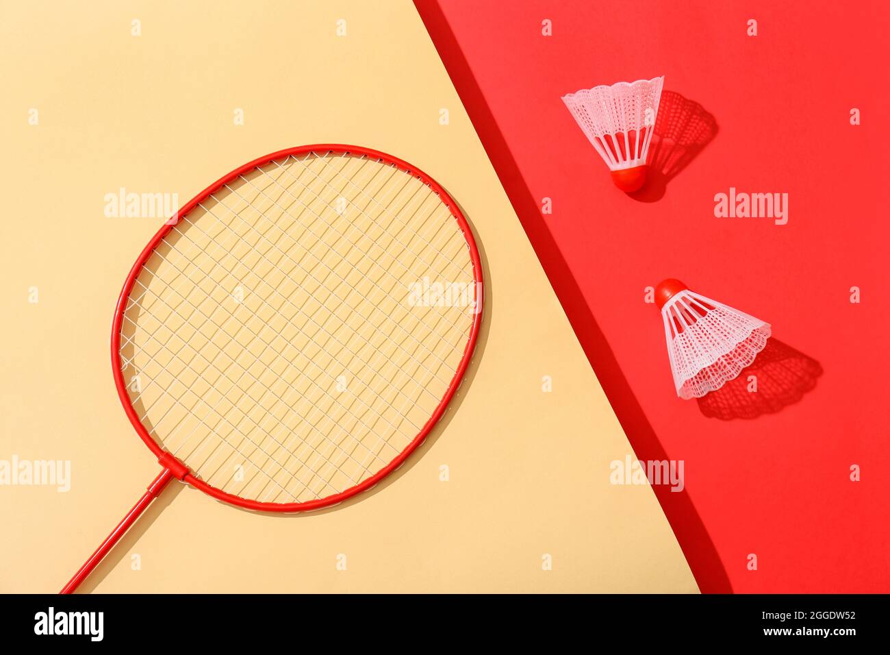 Badminton racket and shuttlecocks on color background Stock Photo - Alamy