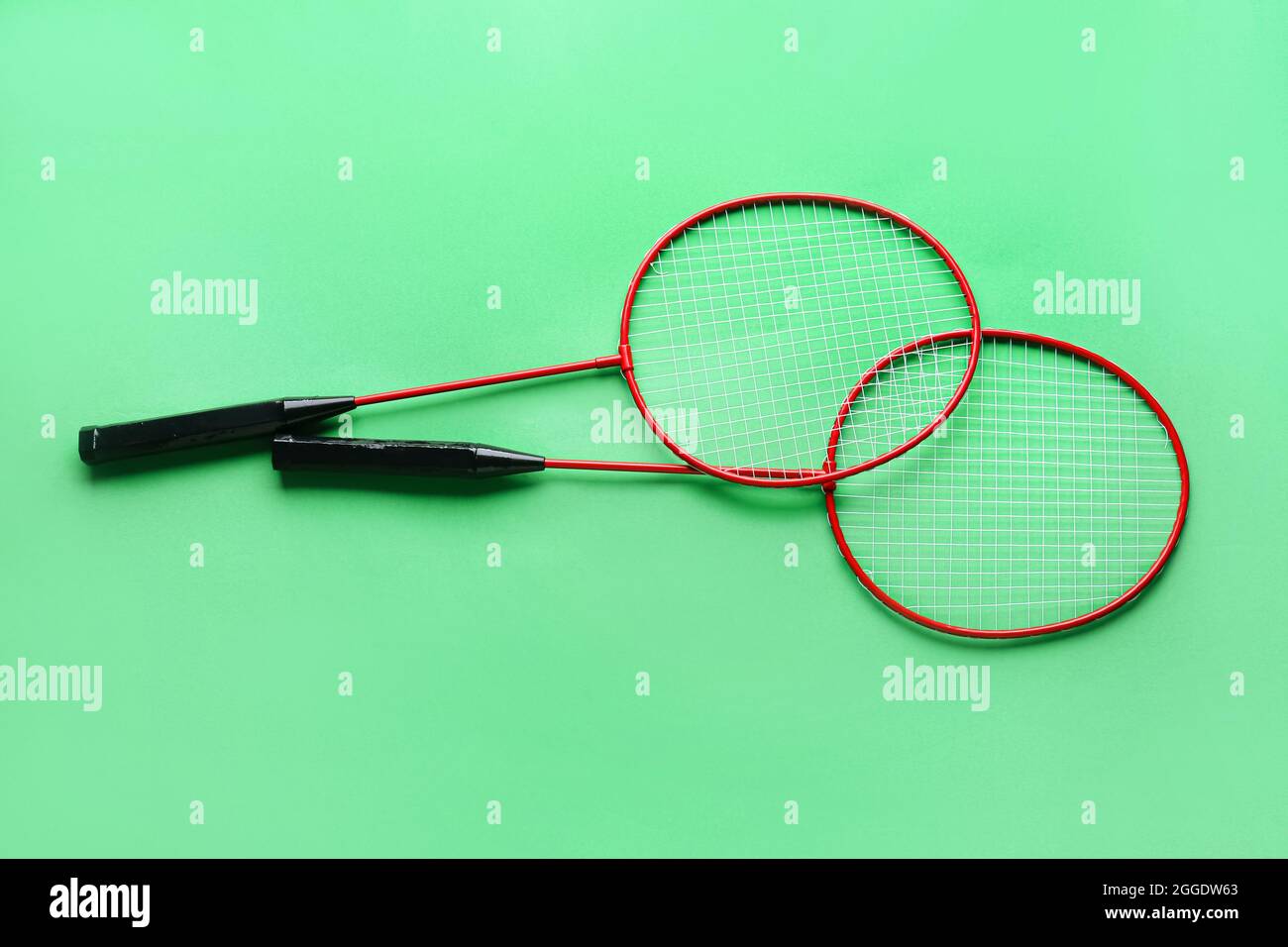 Badminton rackets on color background Stock Photo - Alamy