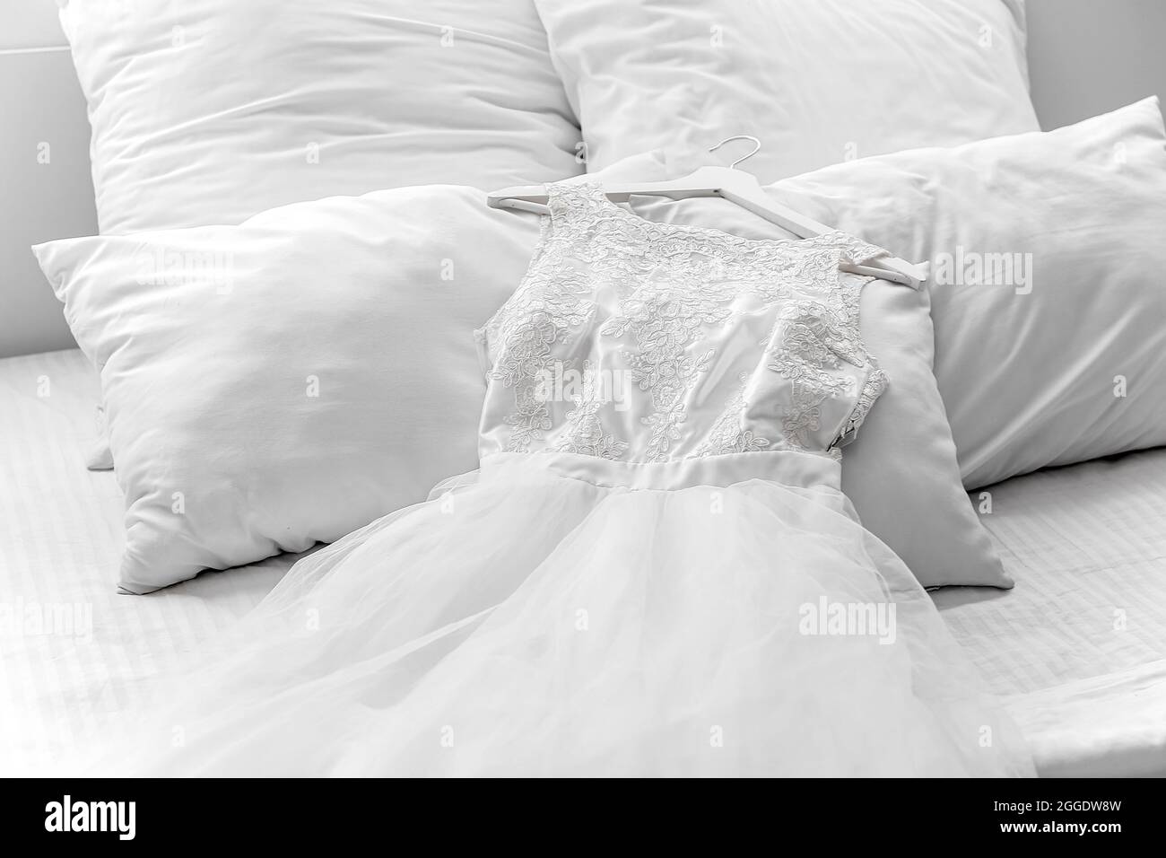 Beautiful wedding dress on bed Stock Photo - Alamy