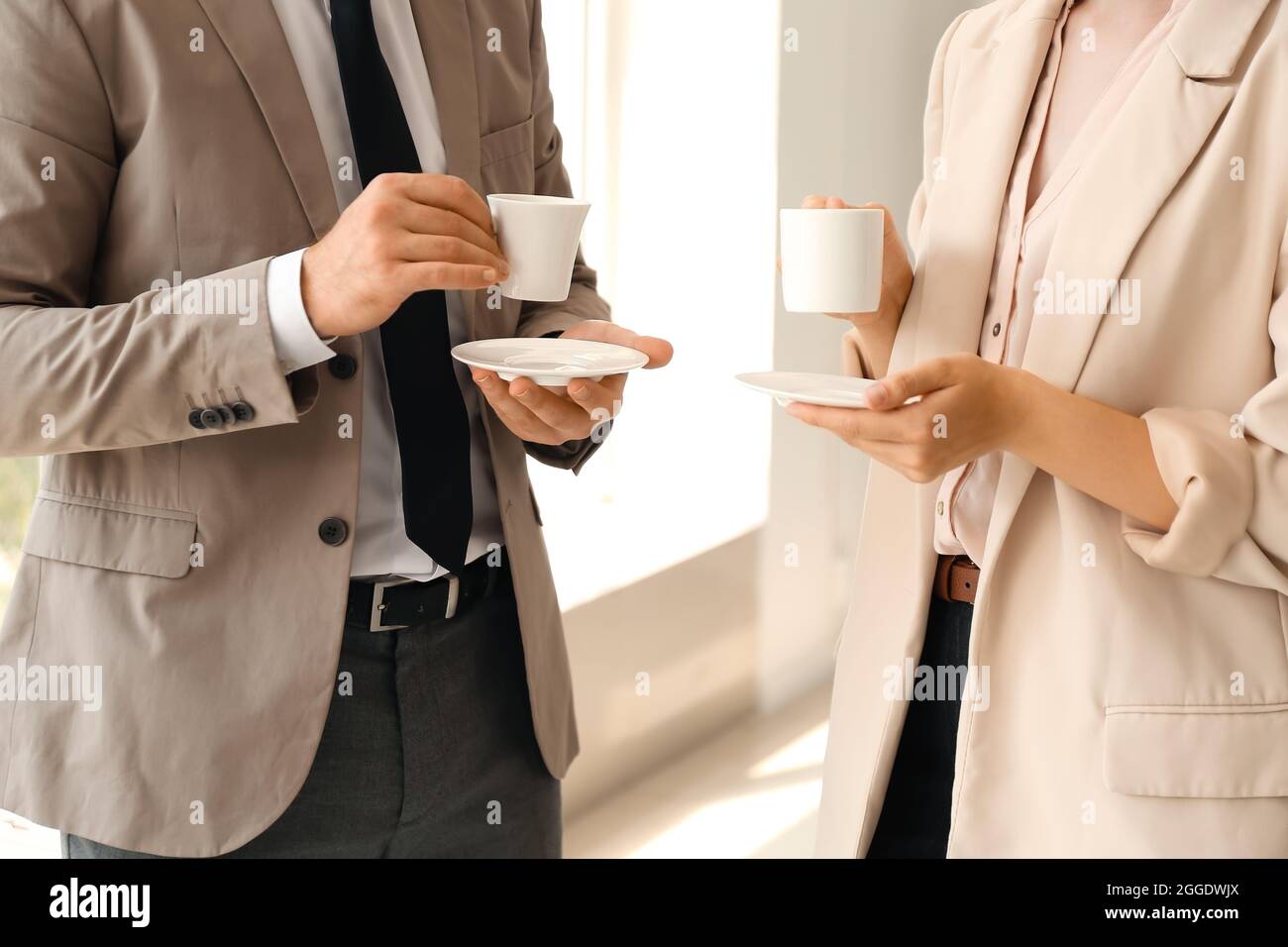 Business people having coffee break in office Stock Photo - Alamy