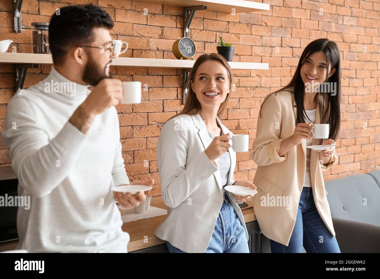 People having coffee break in office Stock Photo - Alamy